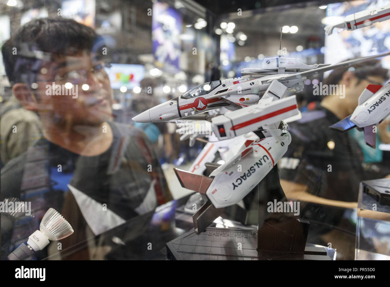 Tokyo, Japan. 29th Sep, 2018. A man looks at a plastic model of a ...