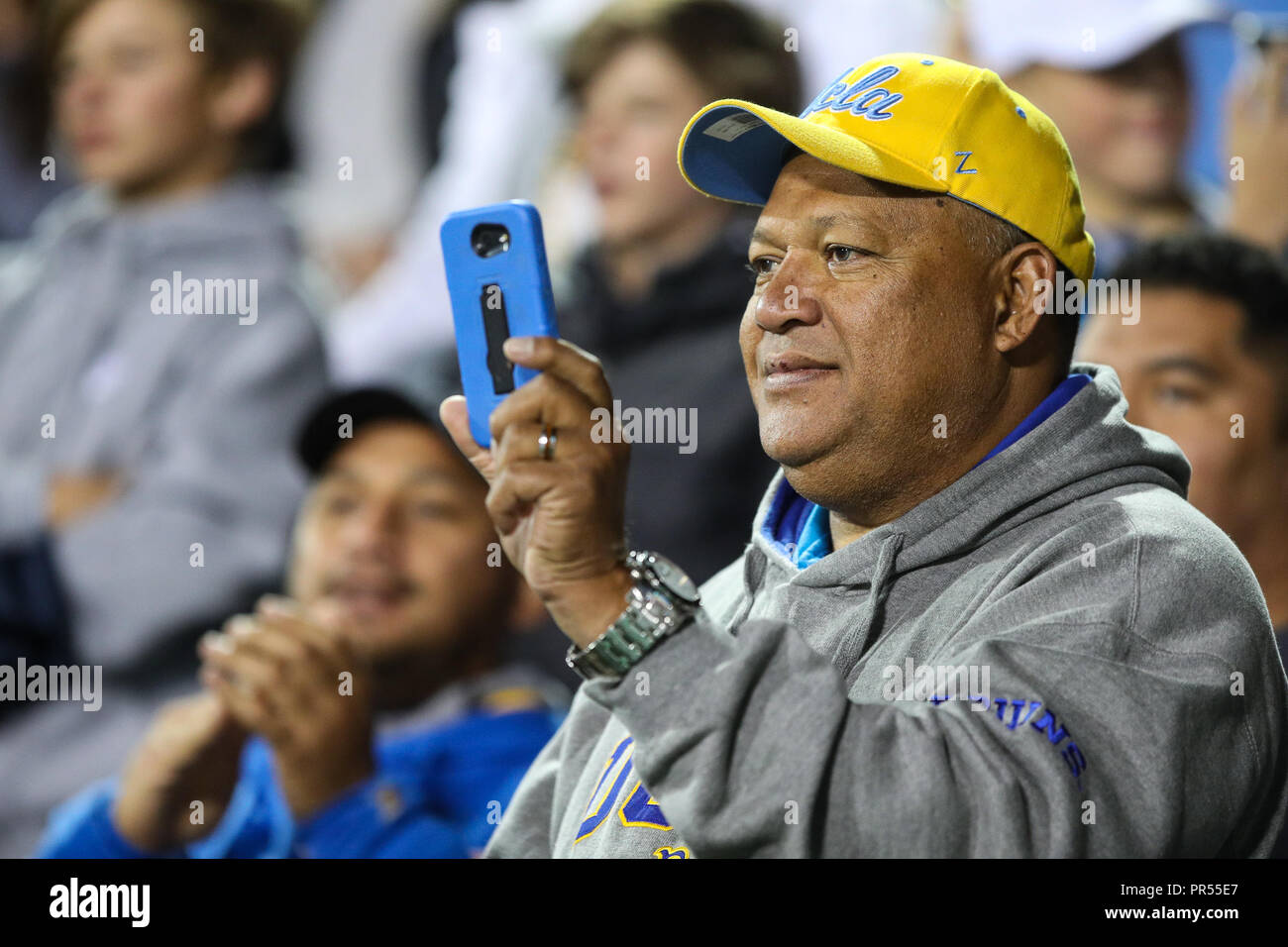 Boulder. 28th Sep, 2018. A UCLA fan vidoes the action on his phone of ...