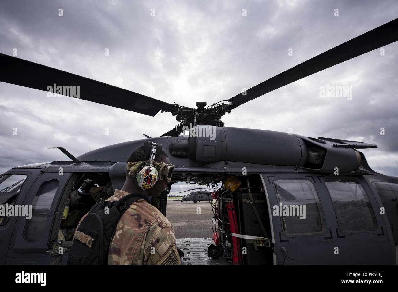 A crew chief assigned to the 334th Air Expeditionary Group prepares an ...