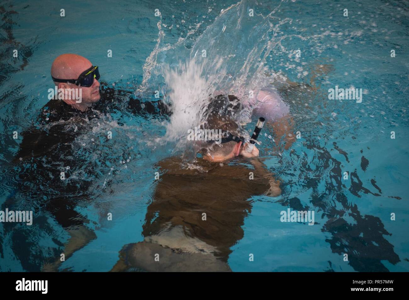 Joe De Sena, founder and CEO of Spartan Race, buddy breathes with a ...