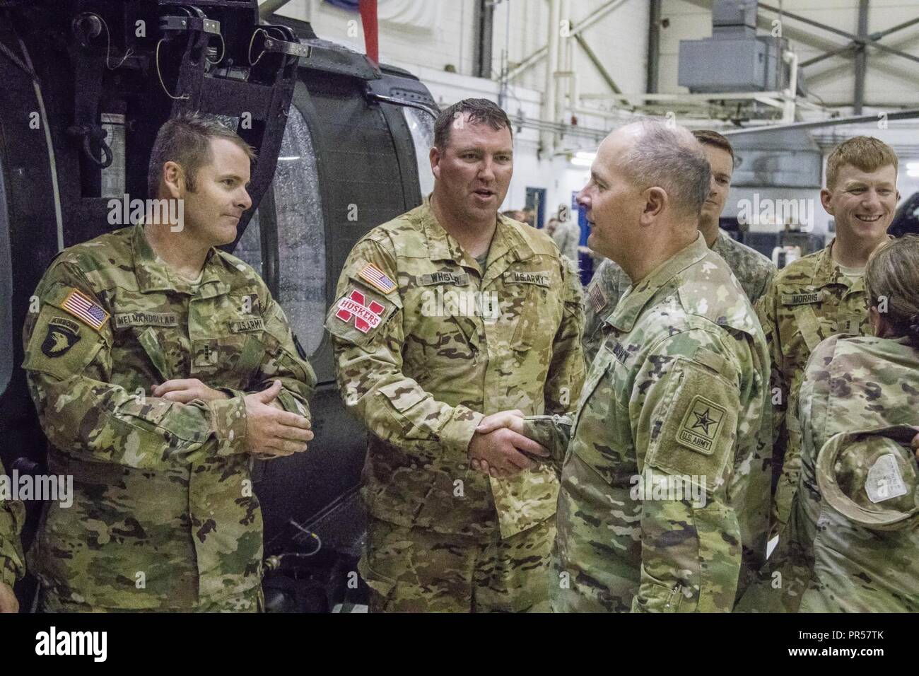 Lt. Gen. Timothy J. Kadavy (right) shakes hands, Sept. 16, 2018, with ...