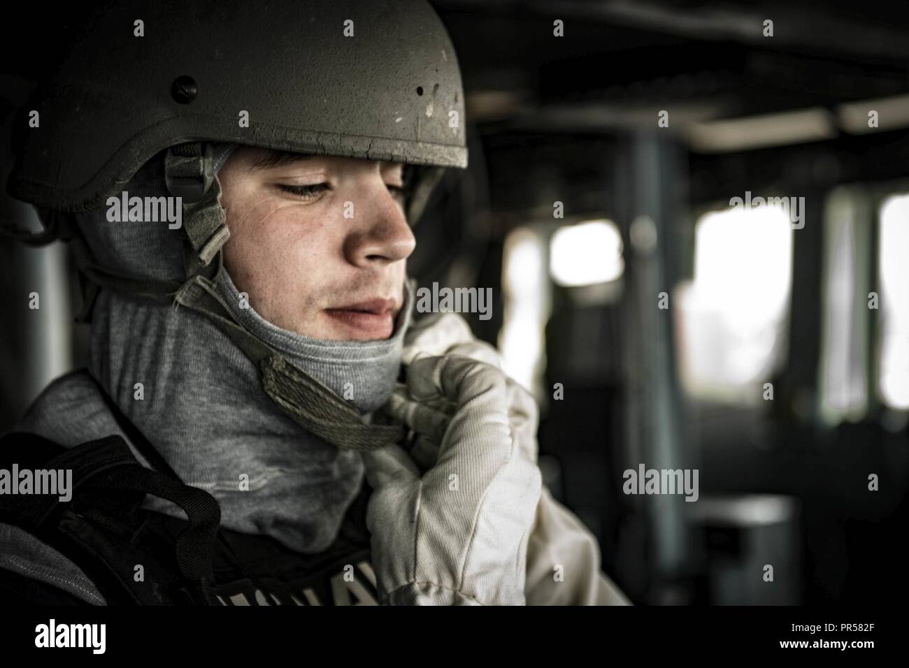 SEA (Sept. 17, 2018) Ensign Garrett Rowe dons protective gear during a ...