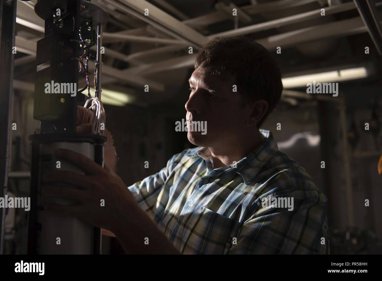 BERING SEA – Peter Koski prepares an ice tethered profiler for Arctic ...