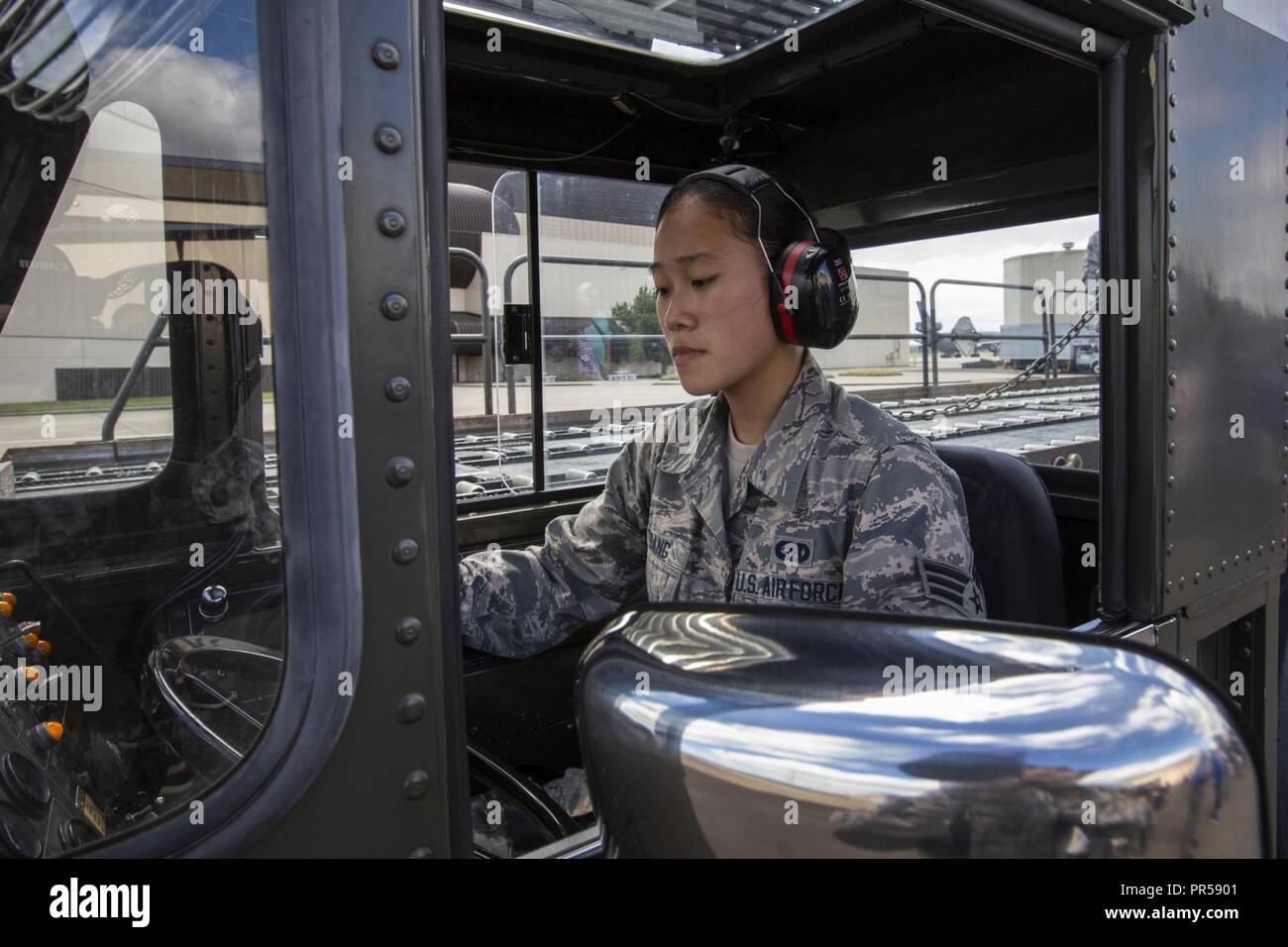 U.S. Air Force Senior Airmen Vince Tsang with the 88th Aerial Port ...