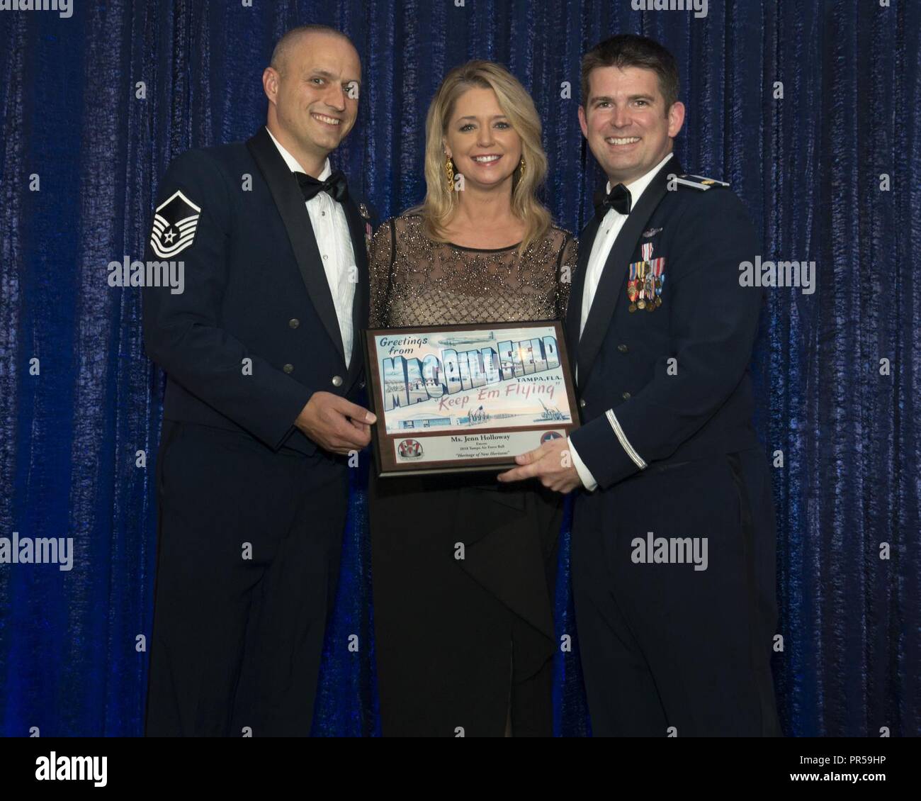 Jennifer Holloway, news anchor, accepts an award at the Hilton Downtown ...