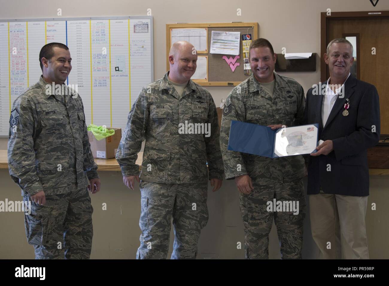 Chief Master Sgt. Brian Pritt (Ret.) (right) poses with some of the ...