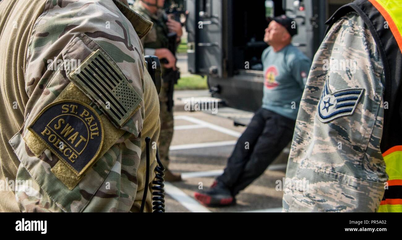 Police officers with the St. Paul Police Department SWAT team respond ...
