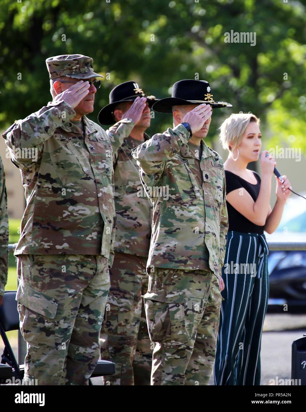 Emily Ozmer, daughter of Lt. Col. Timothy Ozmer sings the National ...