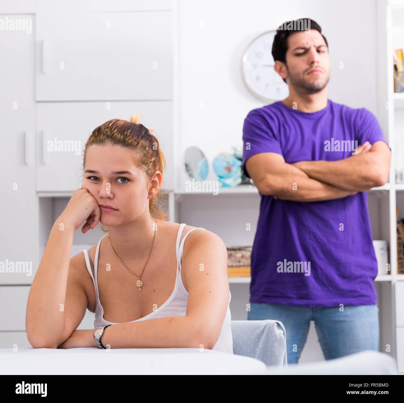 Upset girl sitting at table dont speaking after discord with man ...