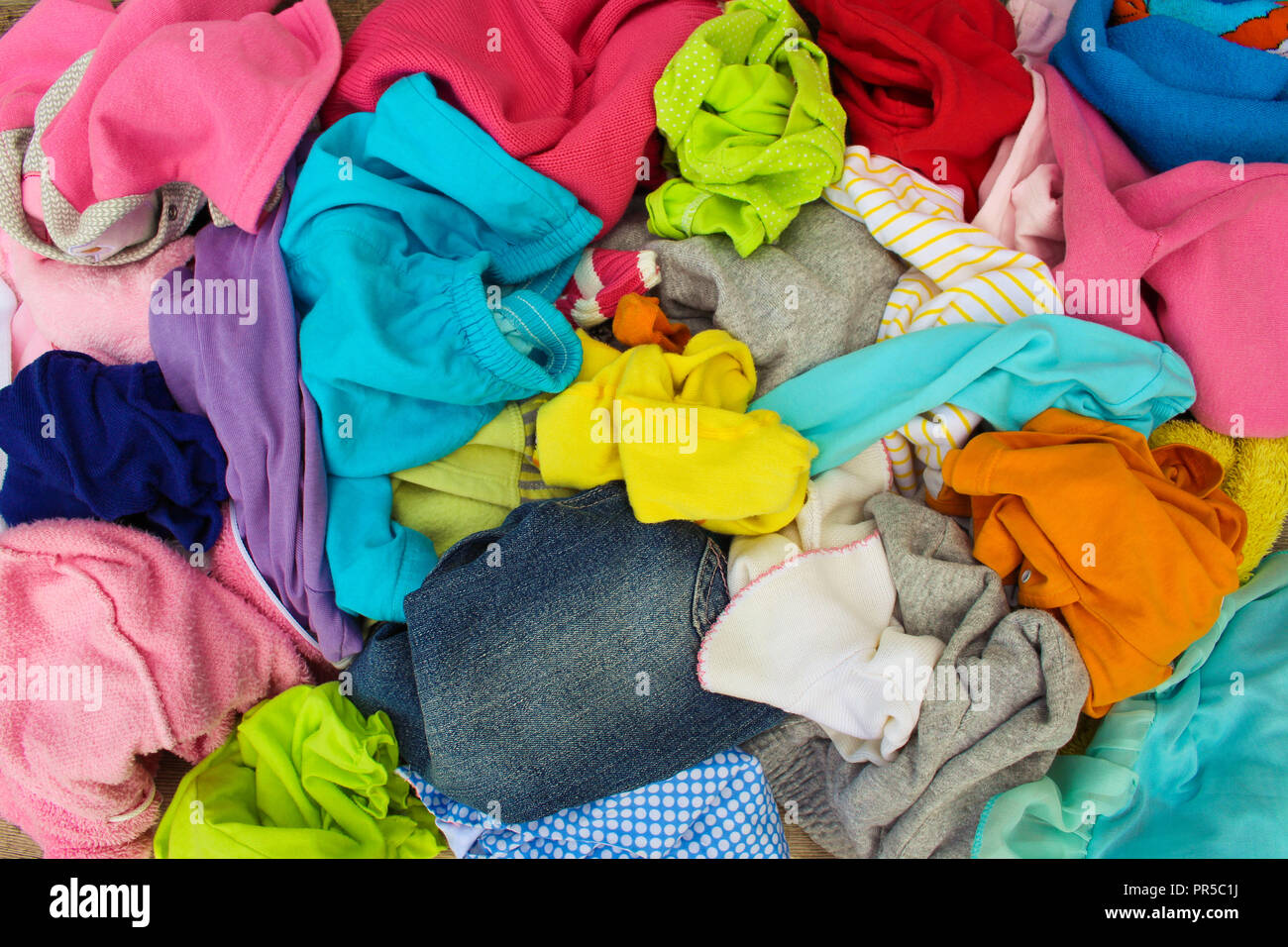 Pile of carelessly scattered clothes Stock Photo - Alamy