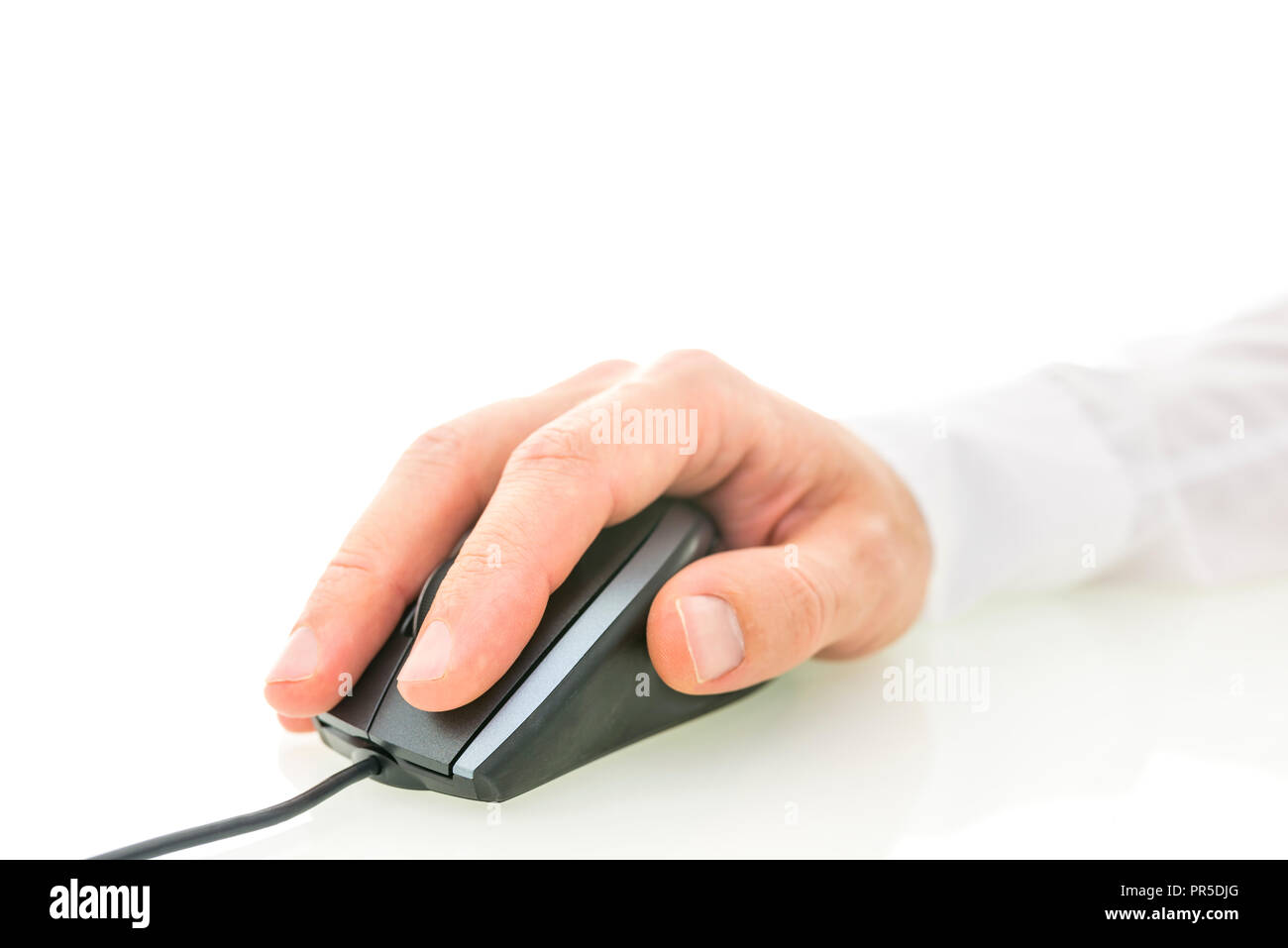 Closeup of male hand using computer mouse. Over white background. Empty ...