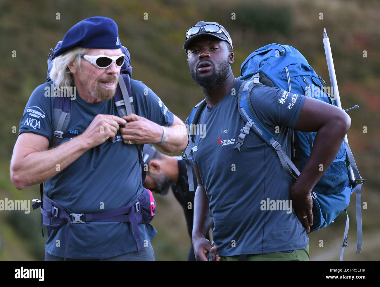 Sir Richard Branson and former gang leader Karl Lokko (right) setting ...