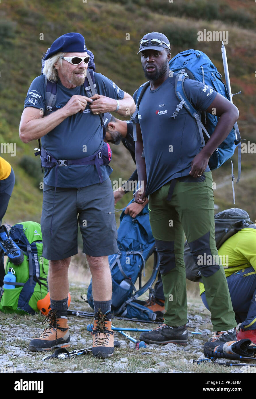 Sir Richard Branson and former gang leader Karl Lokko (right) setting ...