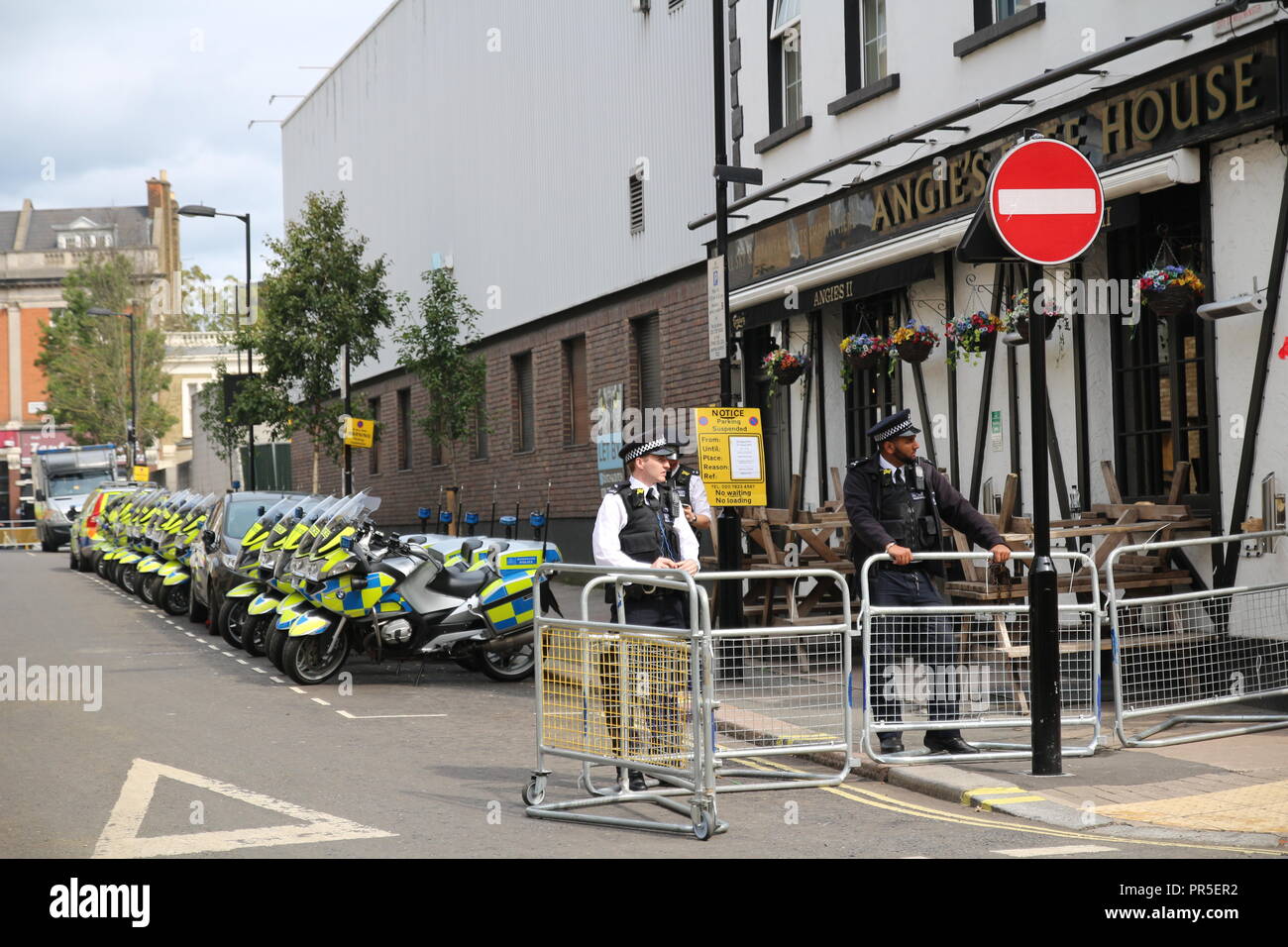 London, UK - August 27, 2018: Police officers and motorcycles were ...