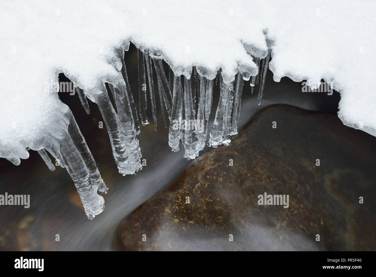 River under the ice and snow. Beautiful icicles Stock Photo - Alamy
