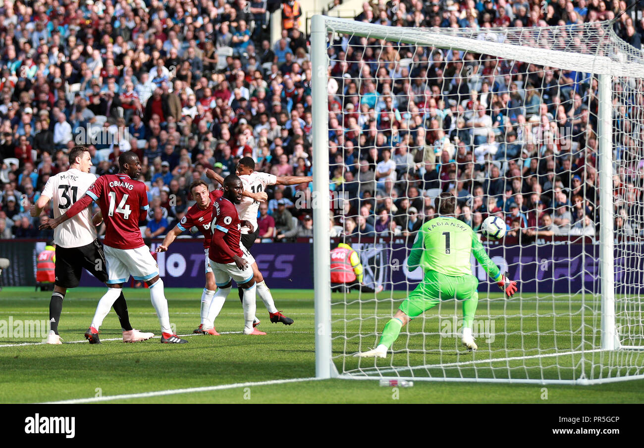 Manchester United's Marcus Rashford scores his side's first goal of the ...