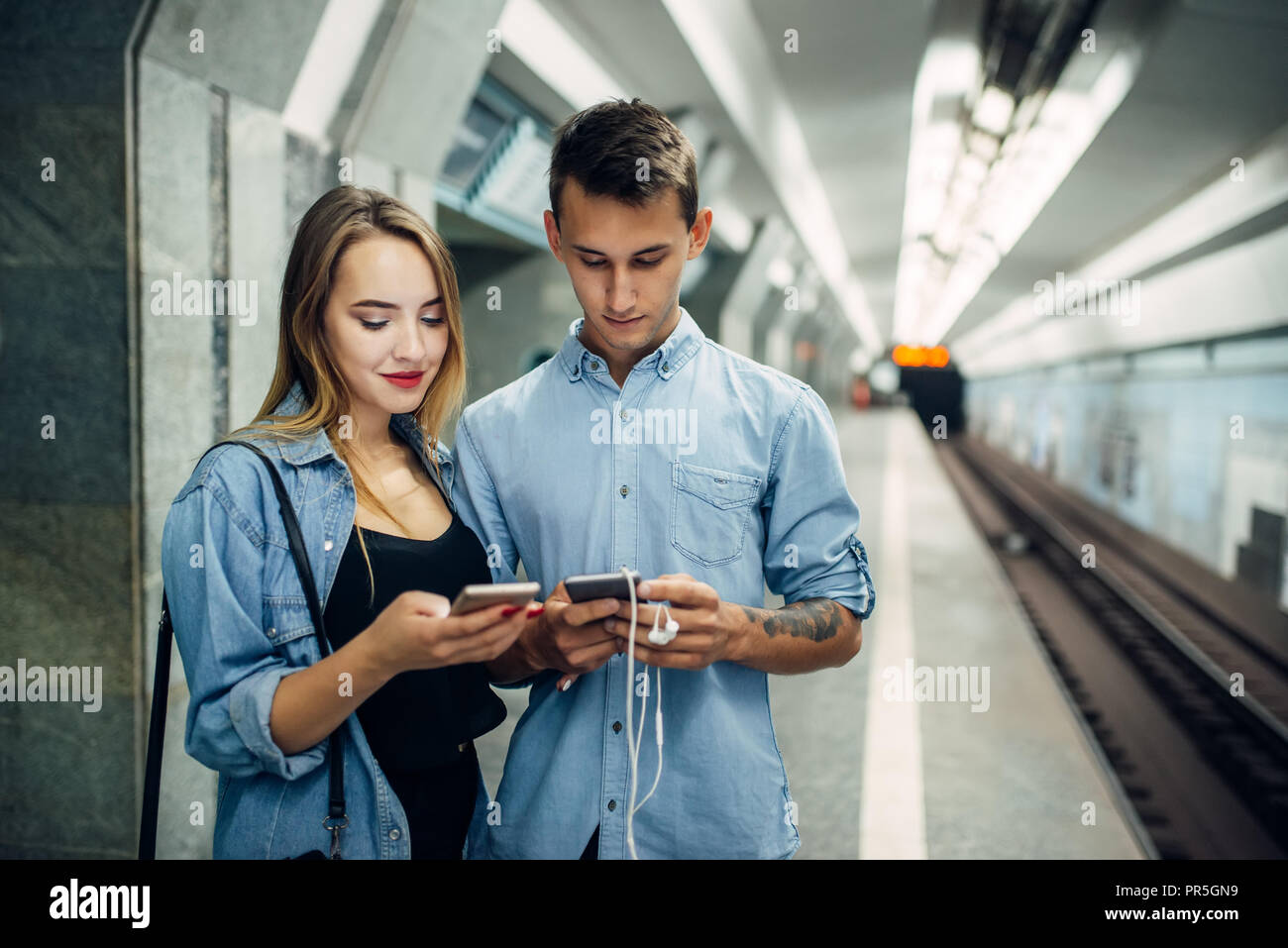 Phone addict couple using gadget in subway, addiction problem, social ...