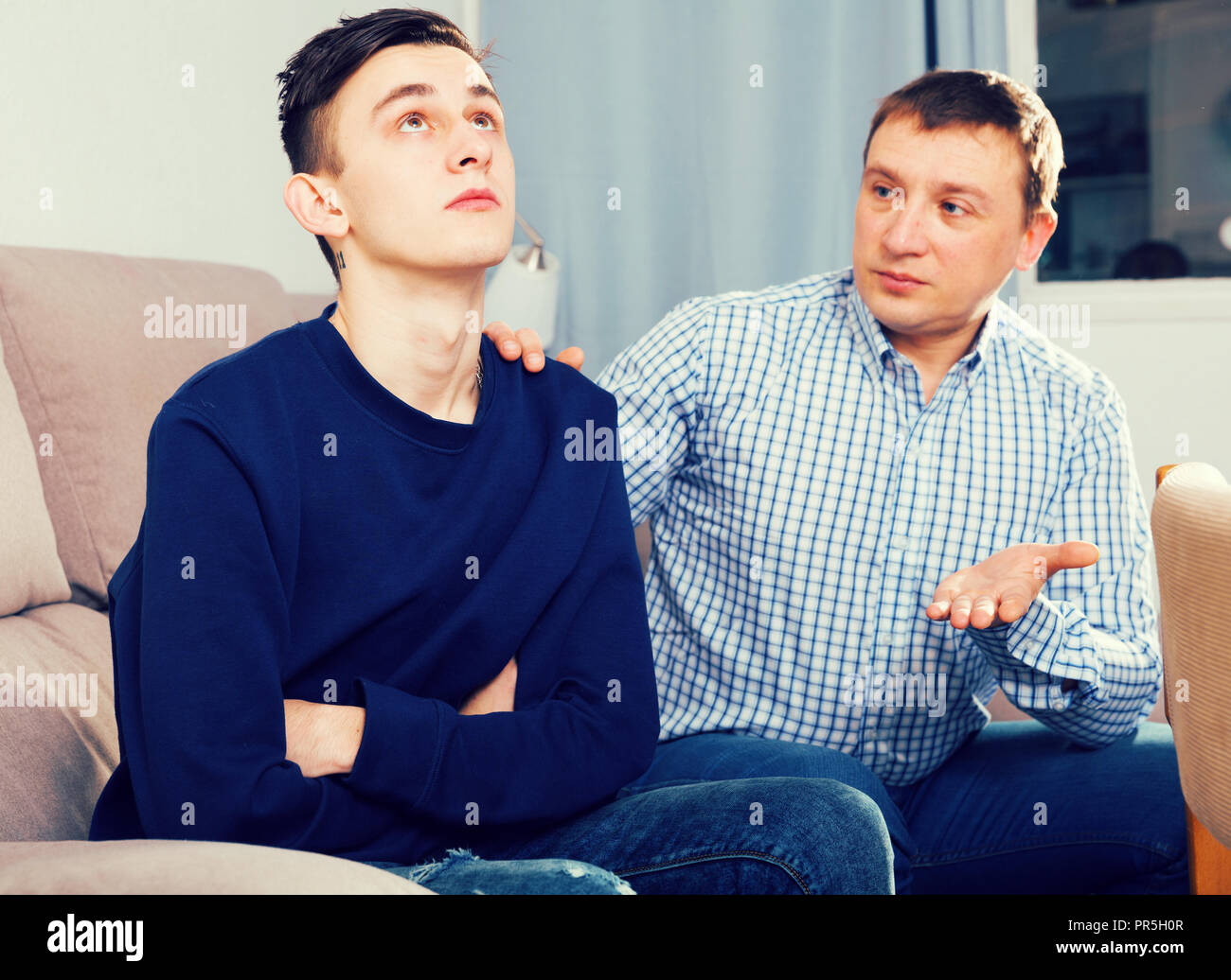 Father is wanting talking with his adult son after conflict at the home ...