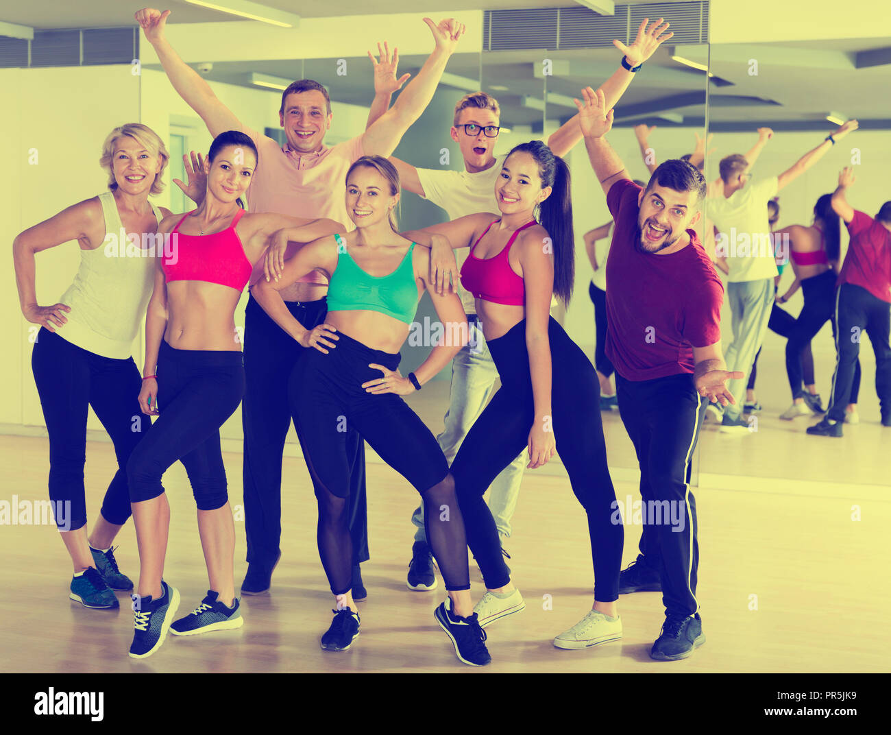 Active males and females dancing excited posing in studio Stock Photo ...