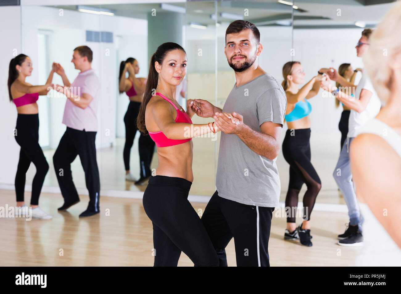 Ordinary dancing pair dance tango together in studio Stock Photo - Alamy