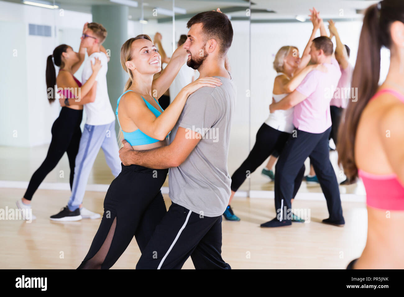 Joyful dancing pair dance together in studio Stock Photo - Alamy