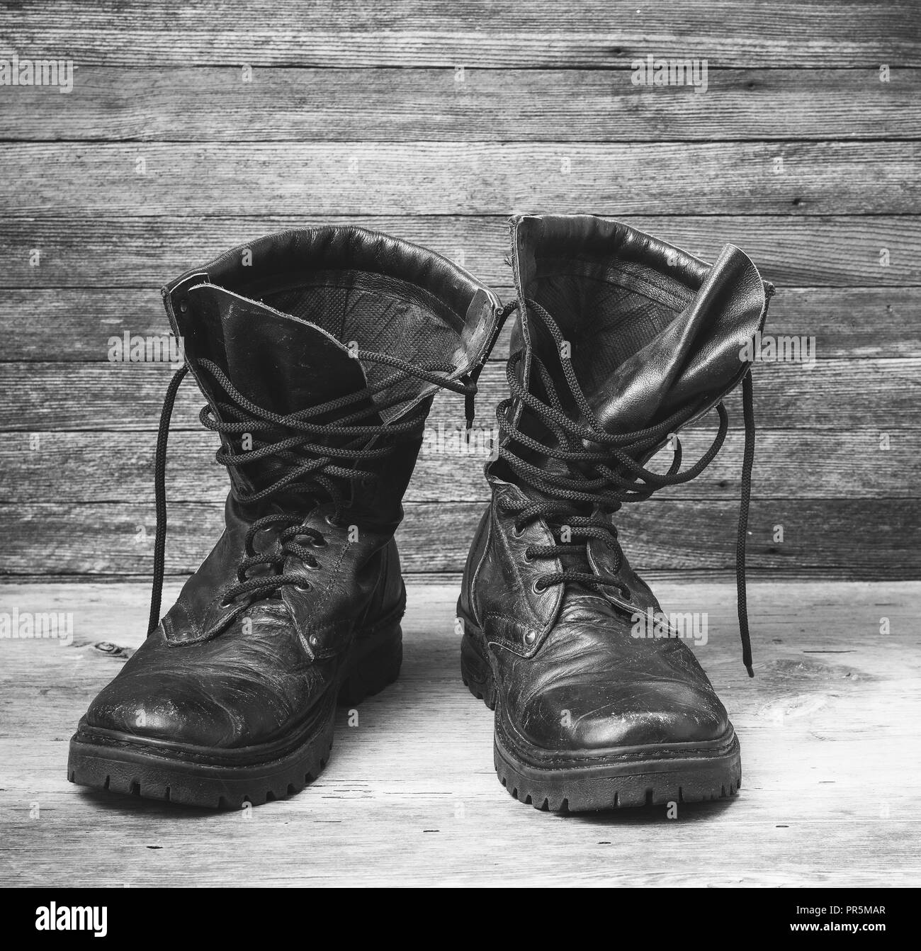 Old worn military boots Black and White Stock Photos & Images - Alamy