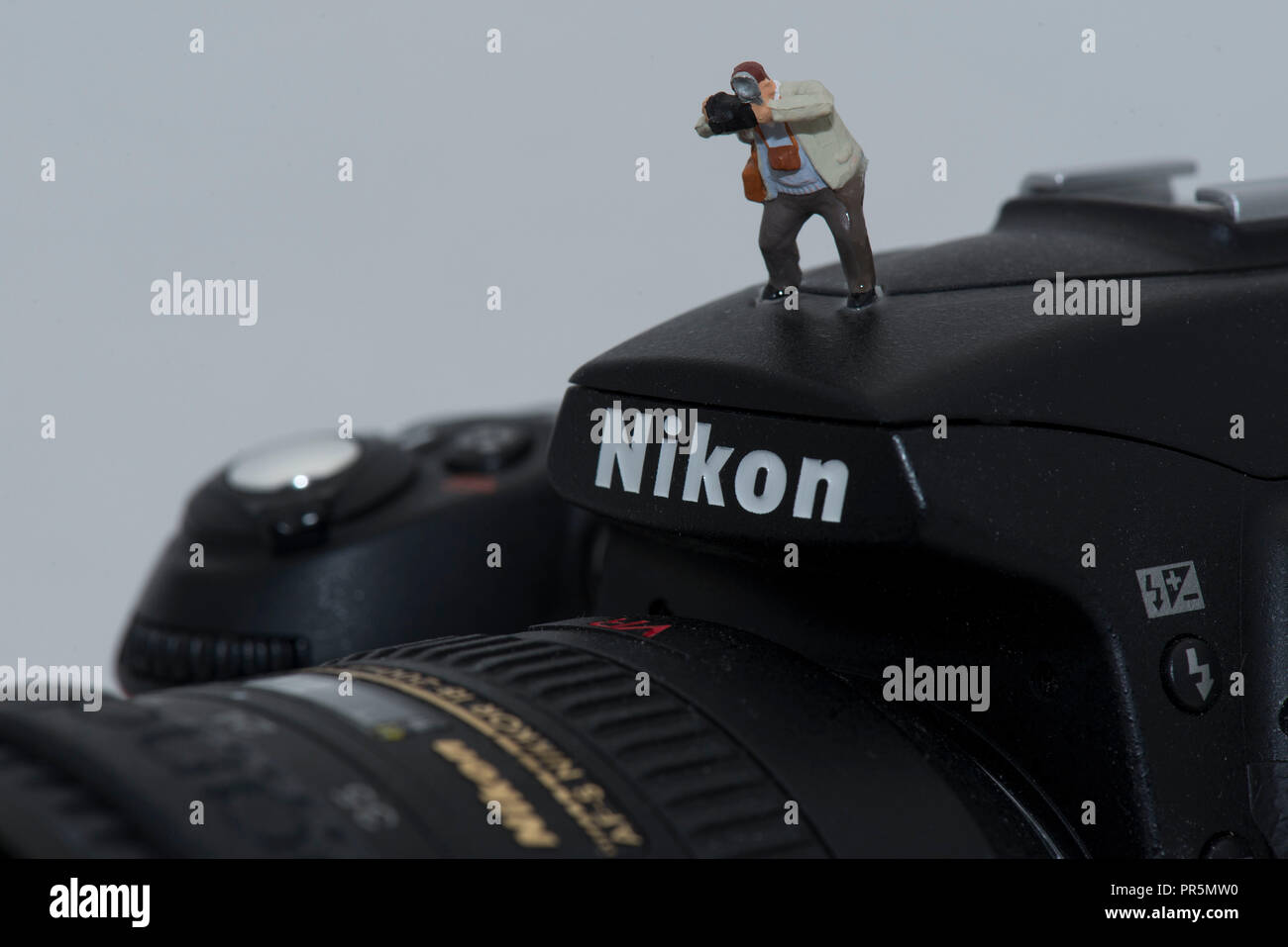 Nikon photographer - toy figure on a camera Stock Photo - Alamy
