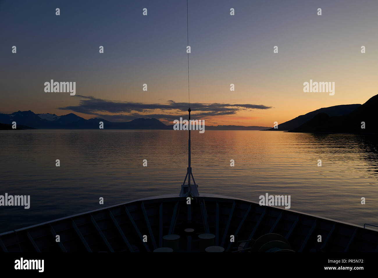 Norwegian Midnight Sun, (Midnatsol), Viewed From The Bow Of A Ship ...