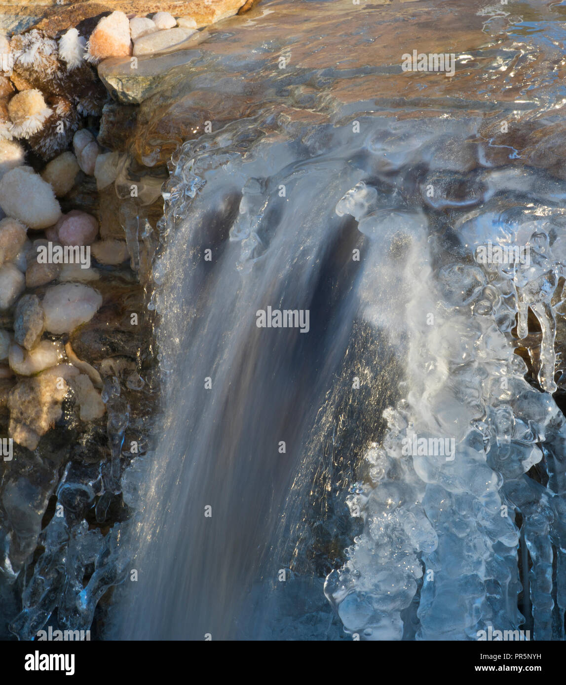 Waterfall still running despite a thick coat of ice atop and on the ...