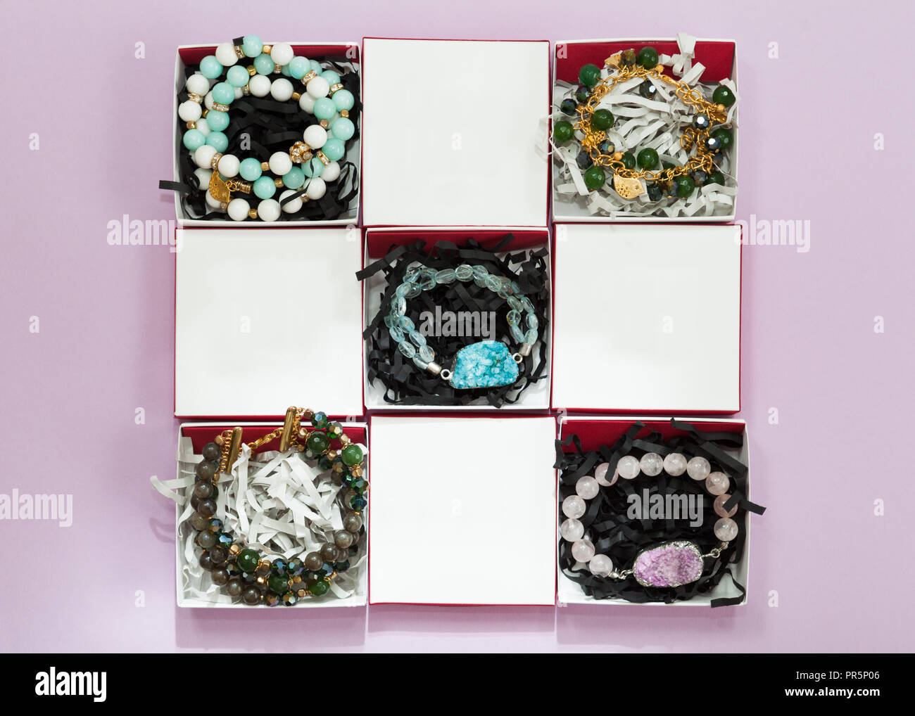 Set of handmade bracelets in white boxes Stock Photo - Alamy
