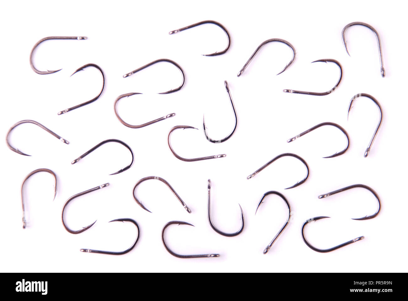 Stainless steel fishing hooks isolated on white Stock Photo - Alamy