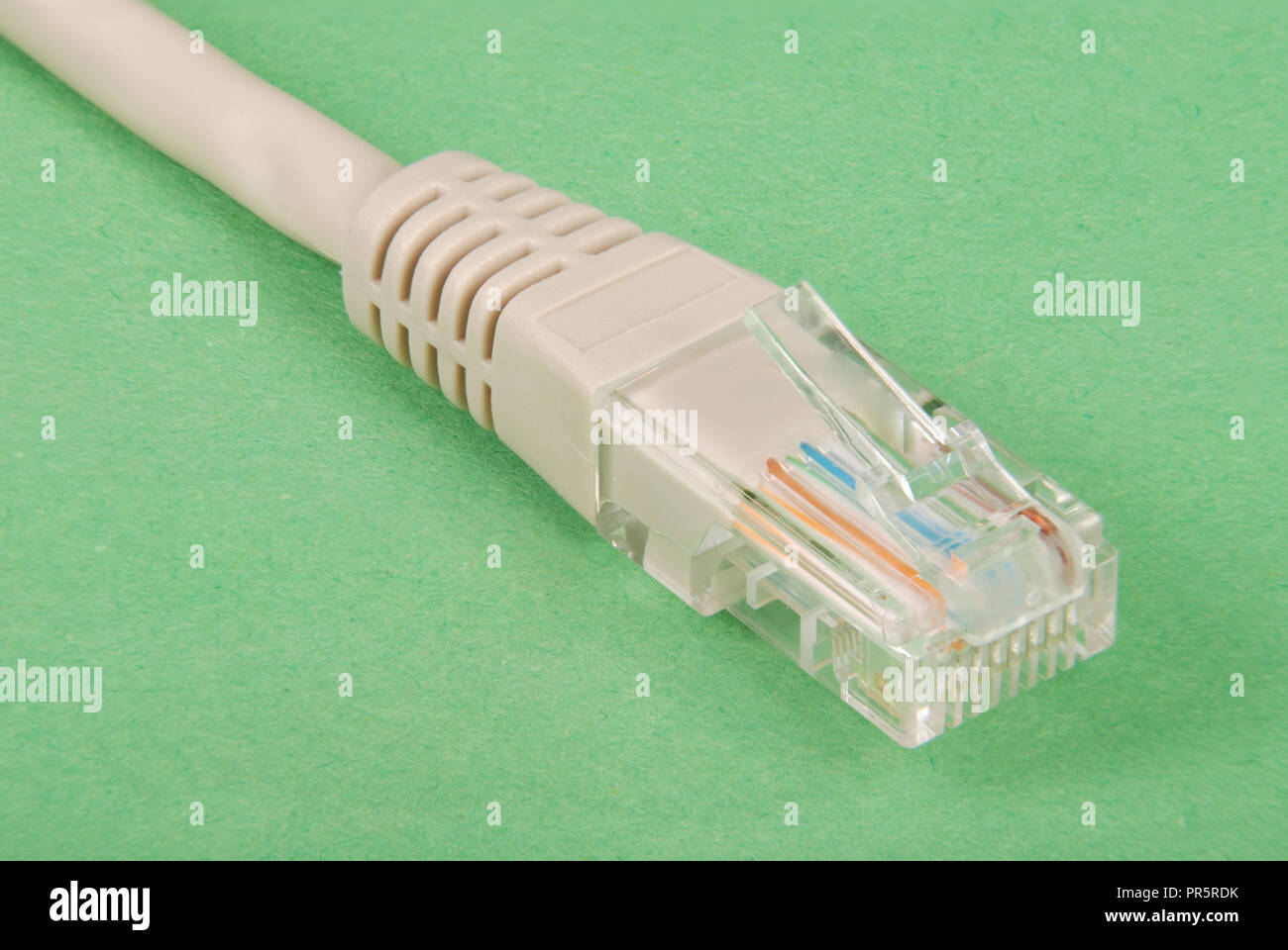 Lan cable and connector RJ45, isolated on green background Stock Photo ...