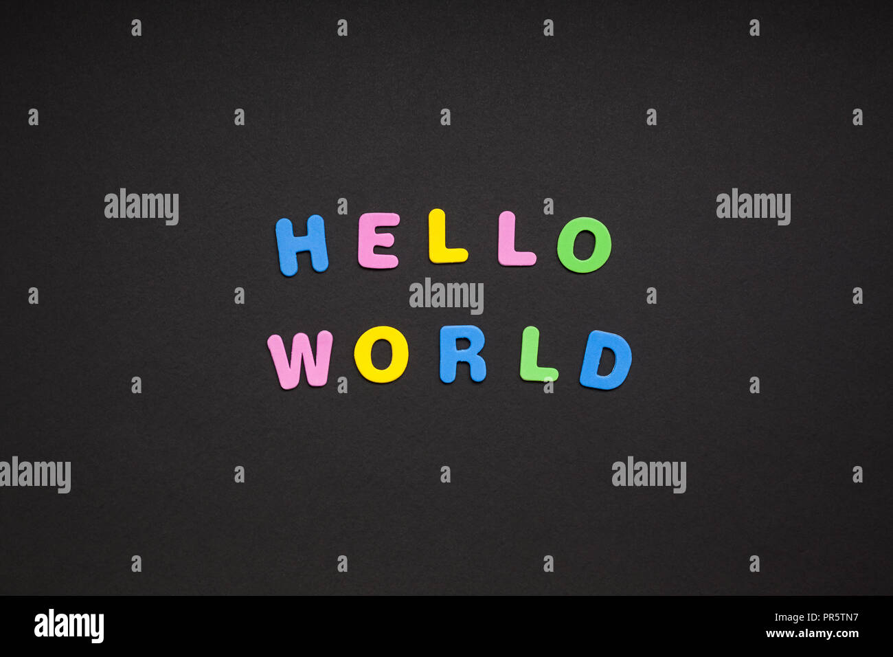 Creative colorful text made from plastic letters Hello world writing on ...