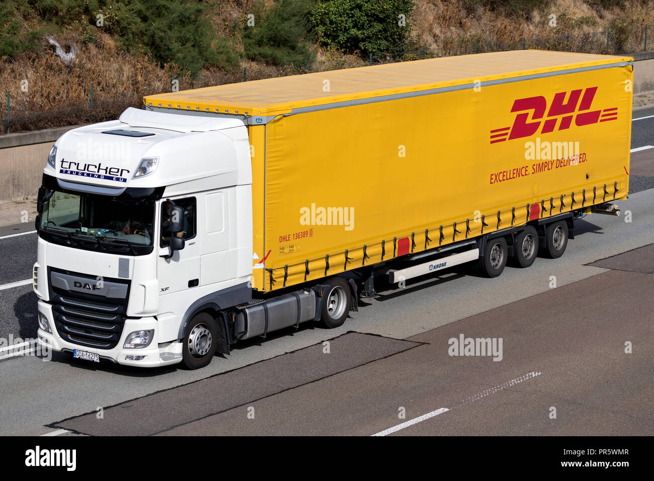 DHL truck on motorway. DHL is a division of the German logistics ...
