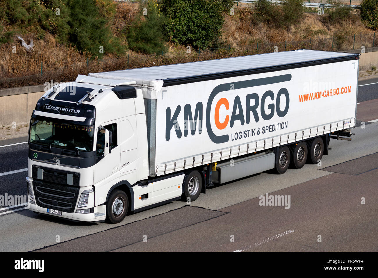 KMCargo truck on motorway. KMCargo has a modern fleet of 90 Mercedes ...
