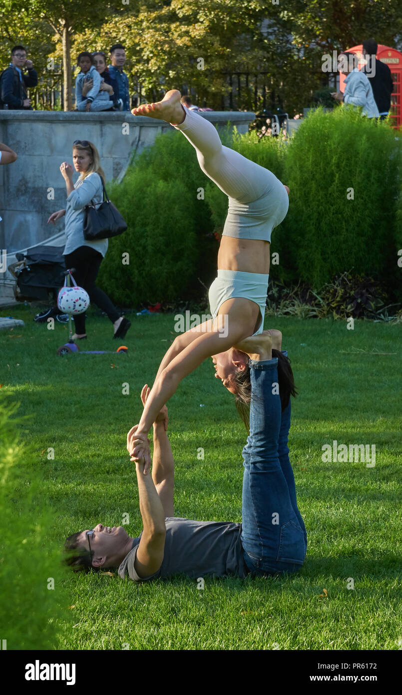 acrobatics fun in park man and woman Stock Photo - Alamy