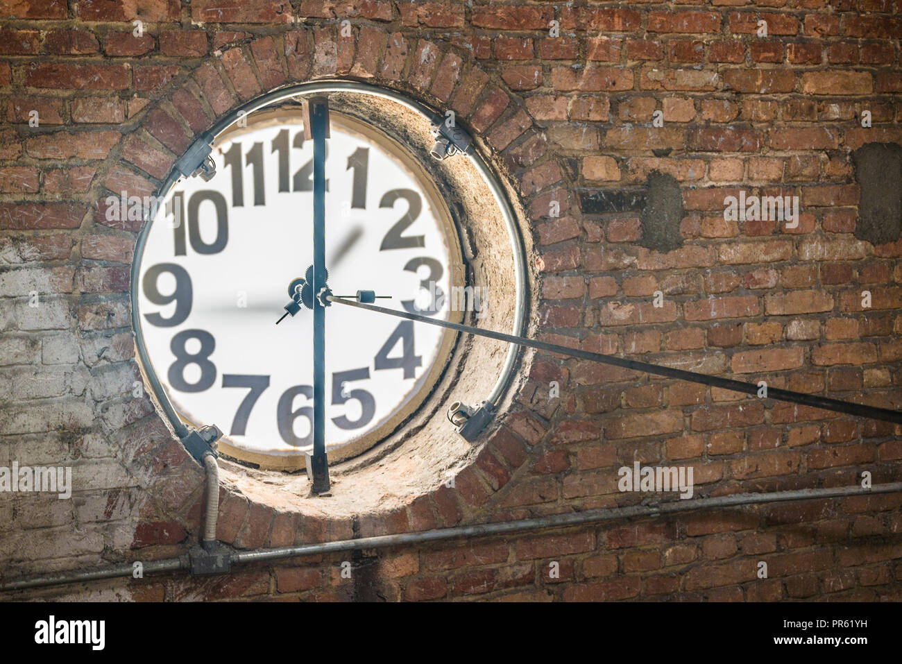 Big old clock embeded at the brick wall Stock Photo - Alamy