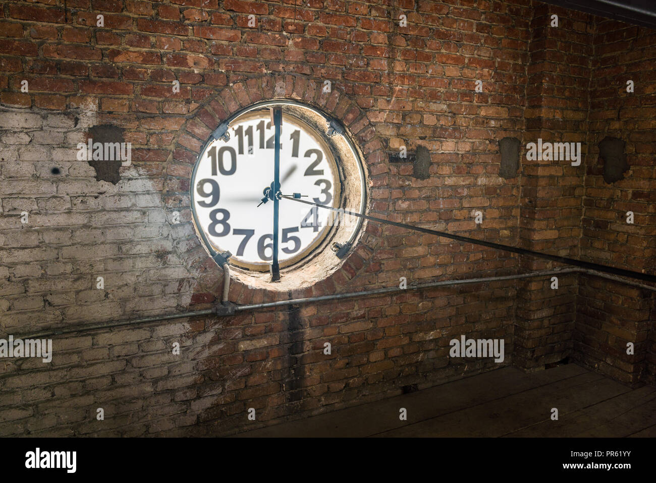 Big old clock embeded at the brick wall Stock Photo - Alamy