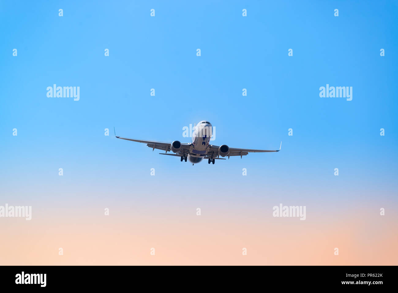 Airplane flying up high and departing from the airport Stock Photo - Alamy