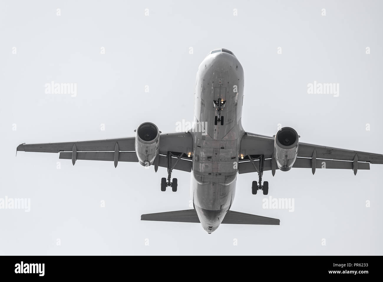 Airplane flying up high and departing from the airport Stock Photo - Alamy