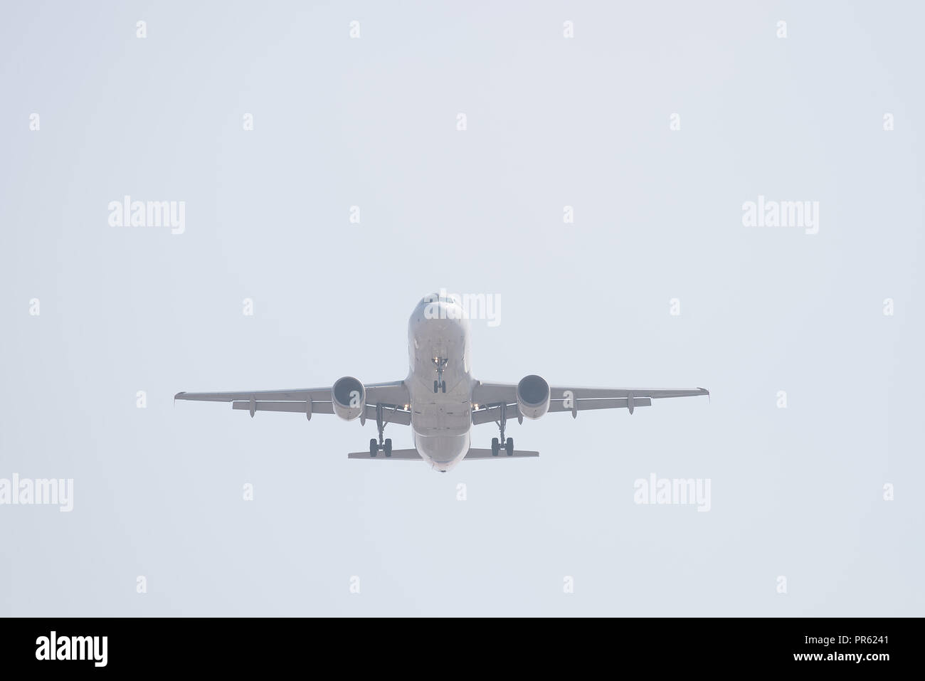 Airplane flying up high and departing from the airport Stock Photo - Alamy