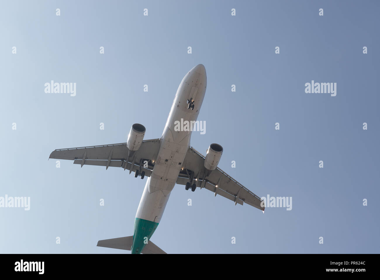 Airplane flying up high and departing from the airport Stock Photo - Alamy