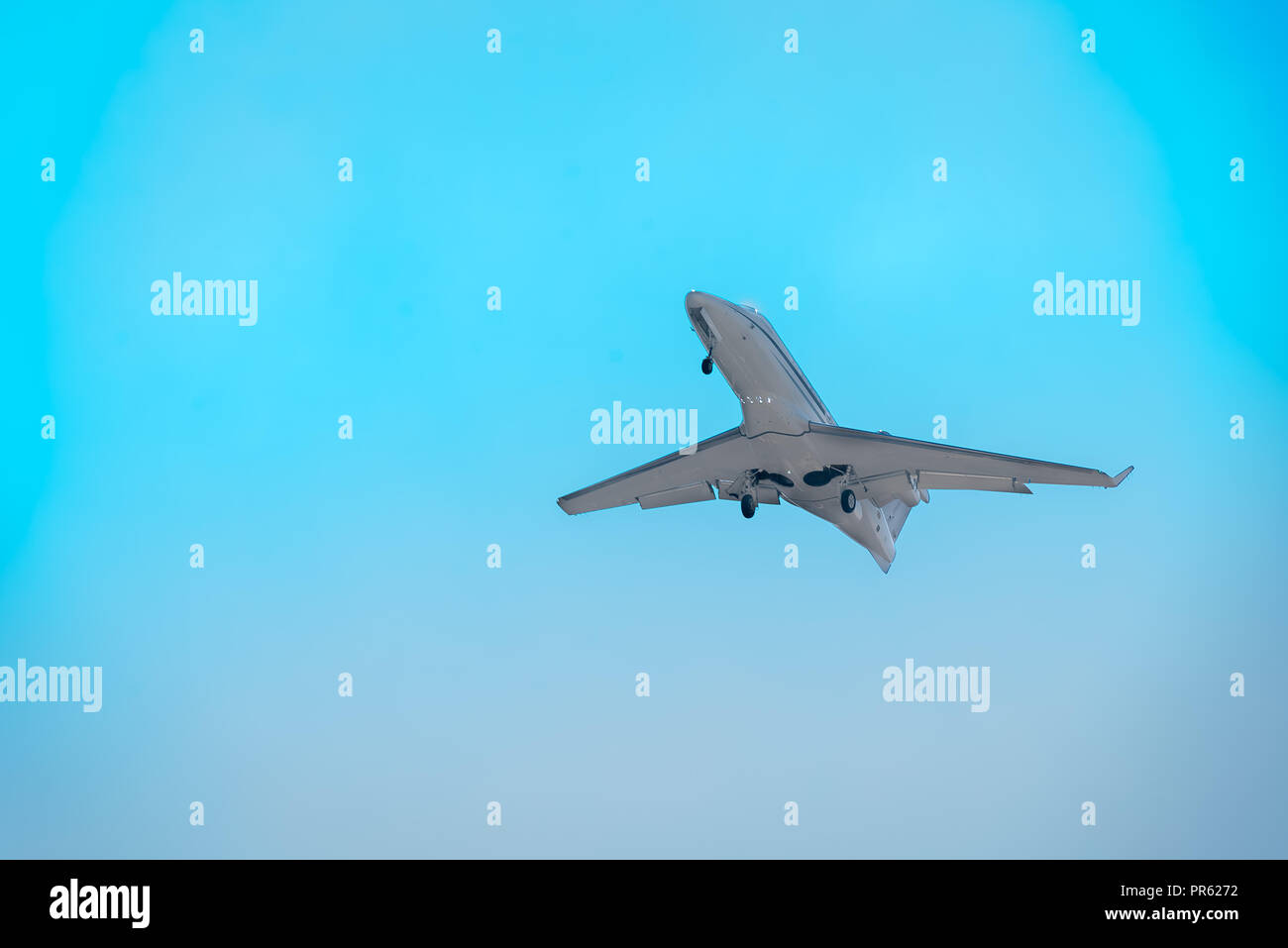 Airplane flying up high and departing from the airport Stock Photo - Alamy