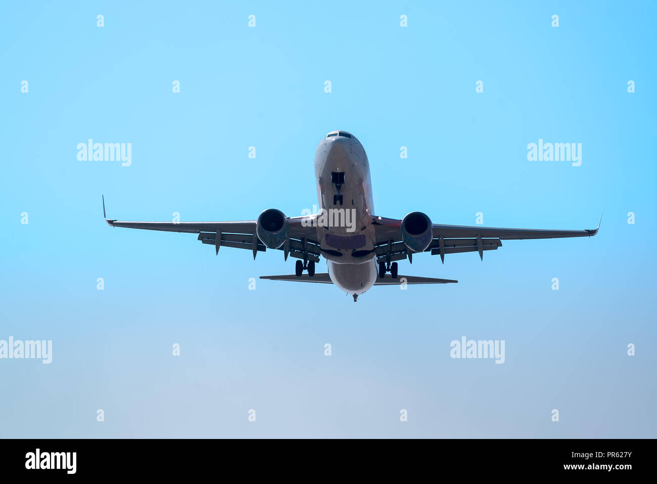Airplane flying up high and departing from the airport Stock Photo - Alamy