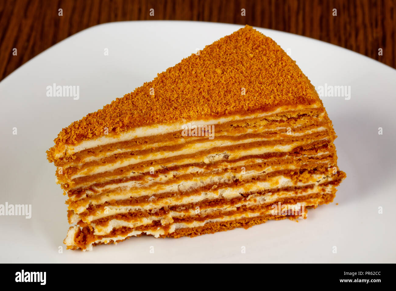 Medovik honey layered cake with cream Stock Photo - Alamy