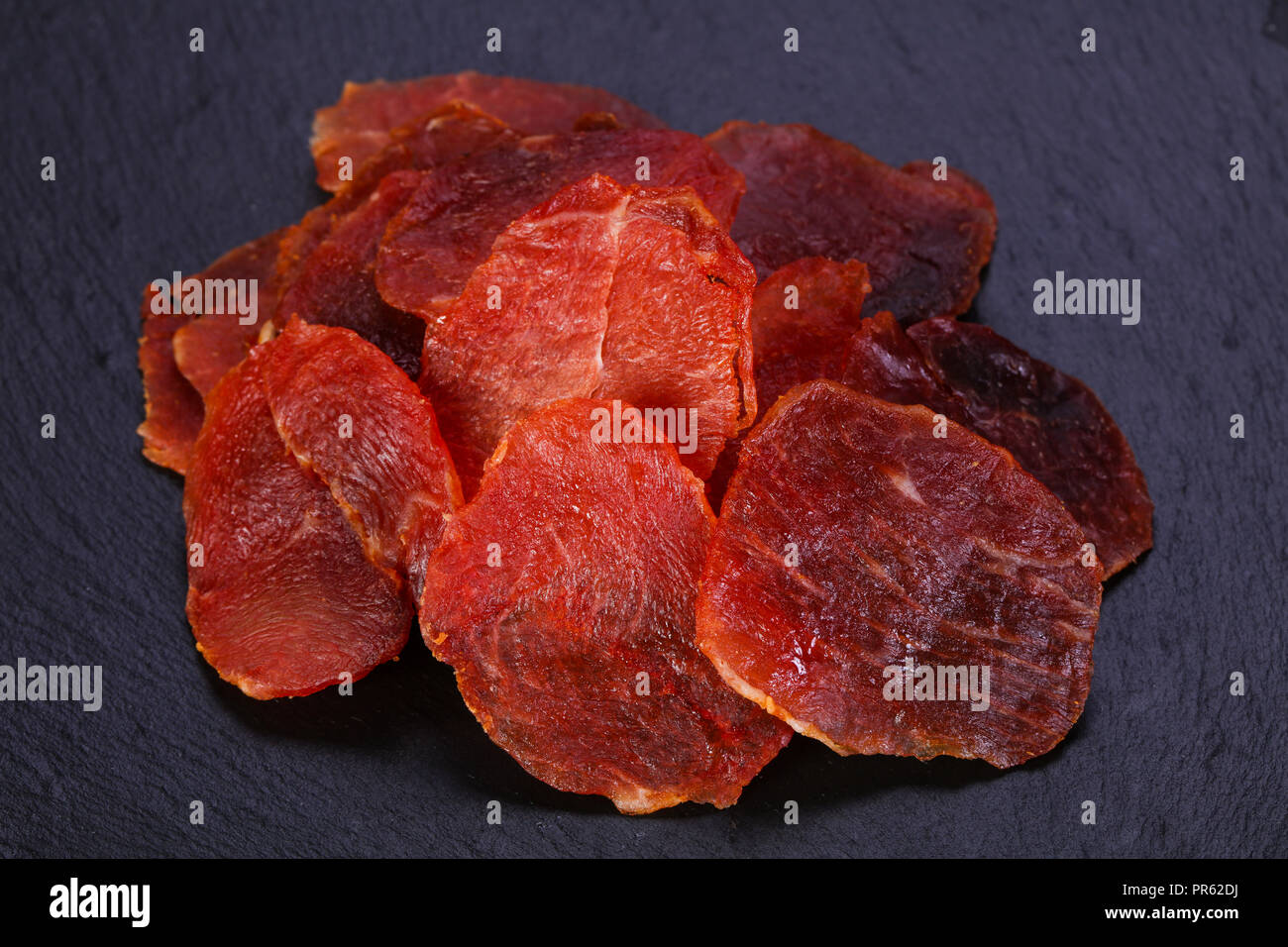 Dry pork meat heap over wooden Stock Photo - Alamy