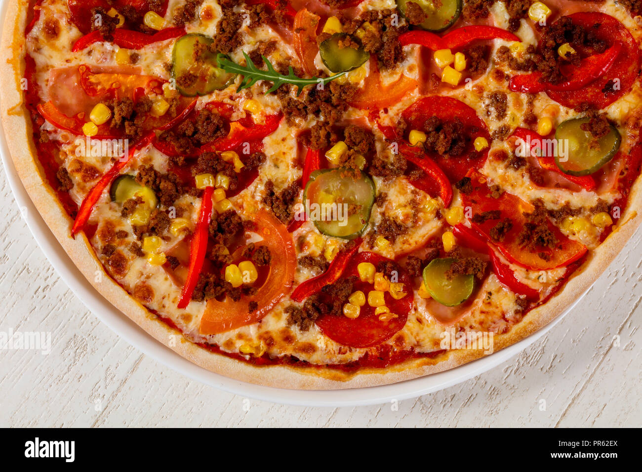 Pizza with minced meat and tomato Stock Photo - Alamy
