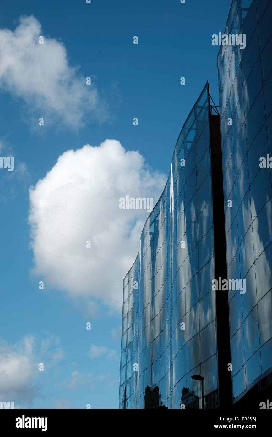 Clouds and blue sky reflected in a modern Building, London, United ...