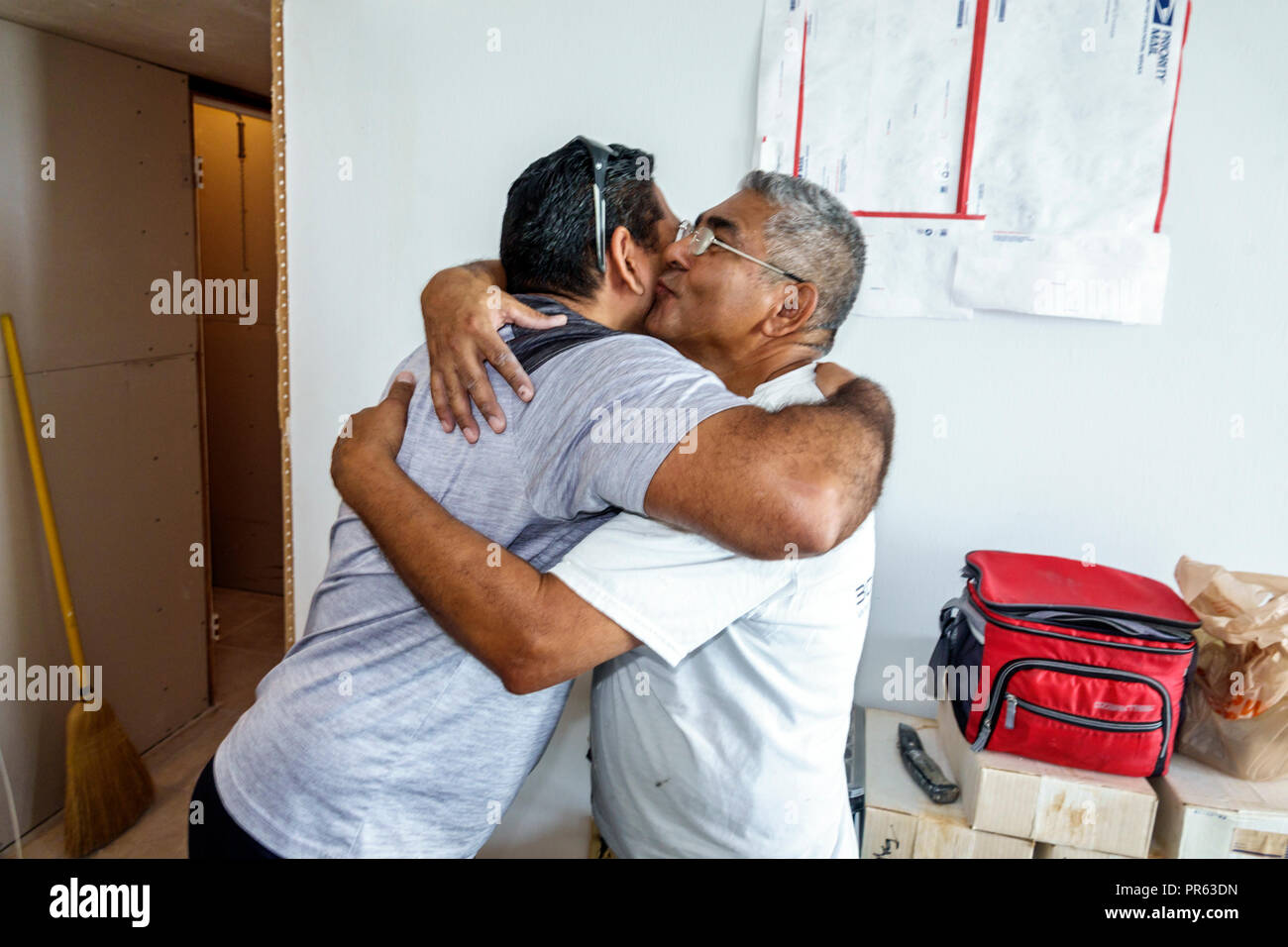 Group hug hispanic family hi-res stock photography and images - Alamy