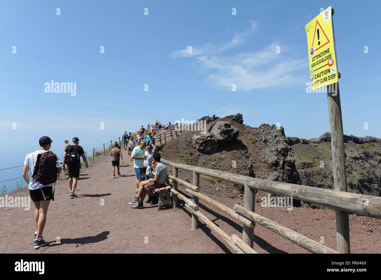 Tourists walking upMount Vesuvius an active volcano above the Bay of ...